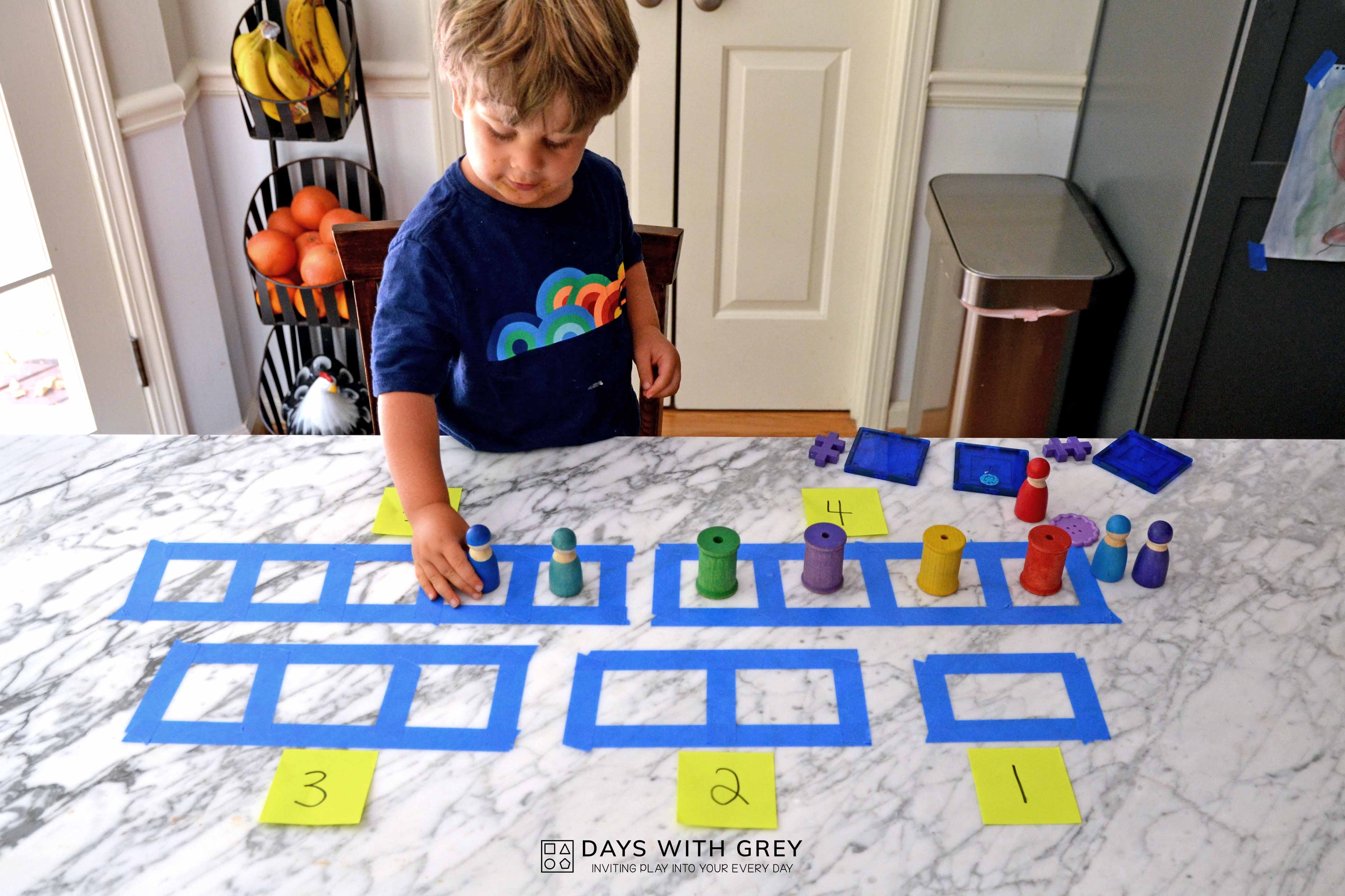 Tape, Toddlers, and Toys: A Toddler Counting Activity - Days With Grey